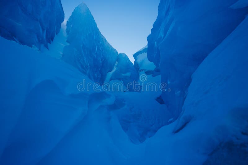 Icy Passageway through Dramatic Intouched Blue Glacier Peaks Stock ...