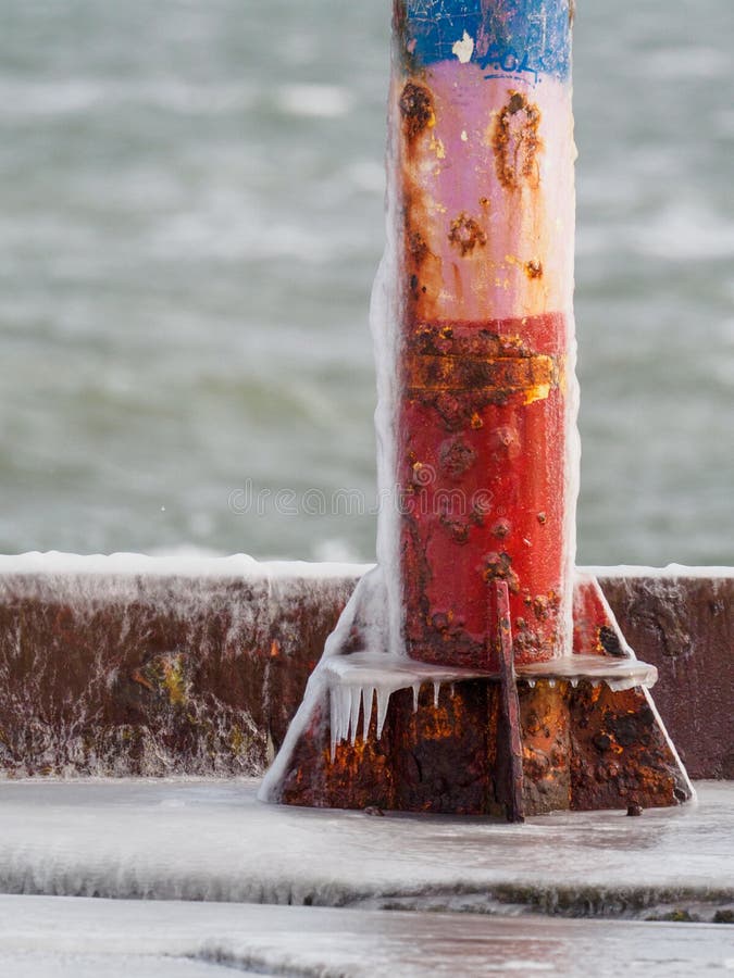 Icy Platform Stands at the End of a Breakwater in the Baltic Sea Stock ...