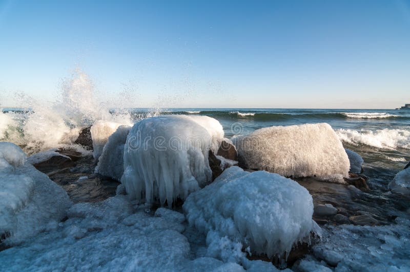 Icy Rocks by a Lake in Winter Stock Image - Image of spray, outdoors ...