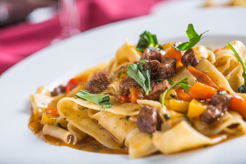 Idalian Pasta Pappardelle with Beef Ragout on White Plate and Re Stock ...