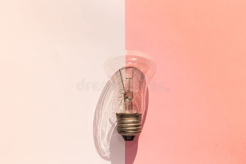 Idea Conception. a Bulb on Divided Background from Above Stock Image ...