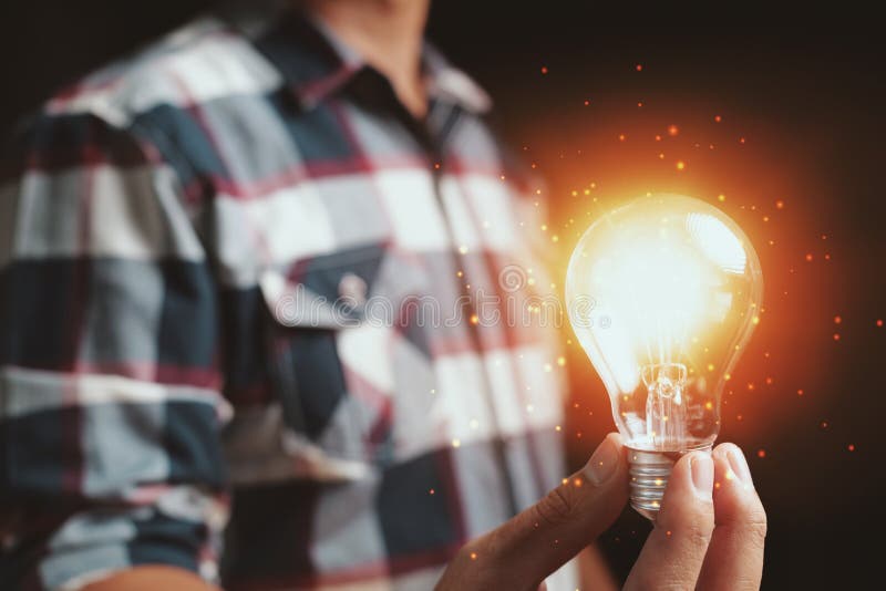 Idea Innovation and Inspiration Concept. Hand of Engineer Holding ...