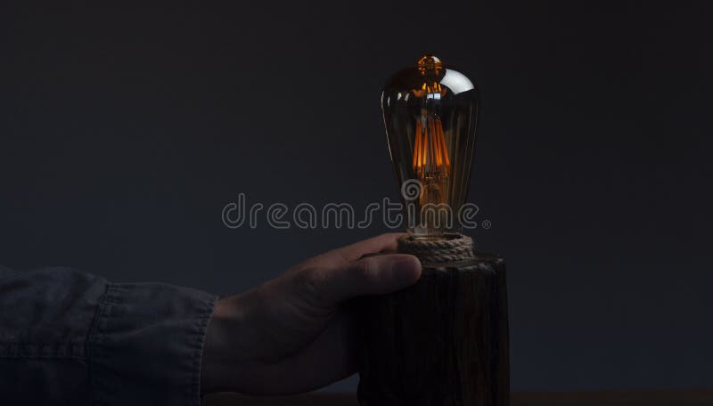 Idea Lamp in Hand in the Dark. Extinguished Lamp. Night Stock Photo ...