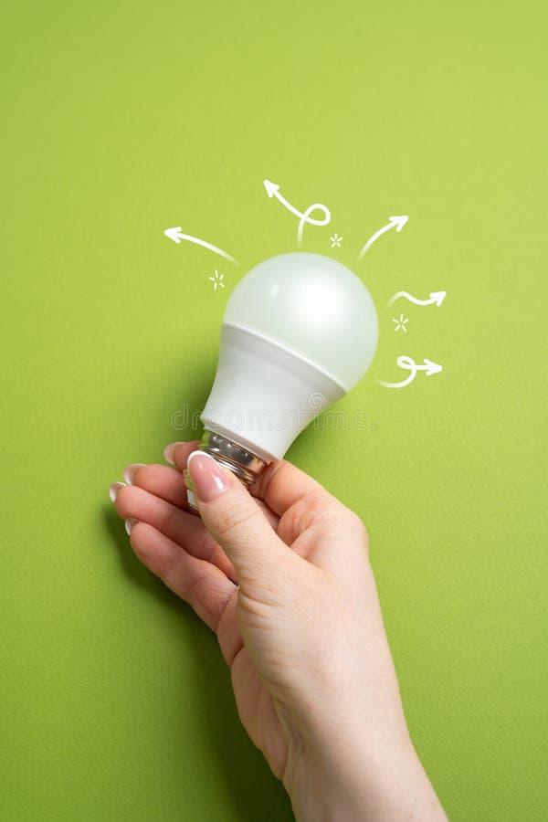 Idea and Motivation for Development. Light Bulb in Hand Stock Photo ...