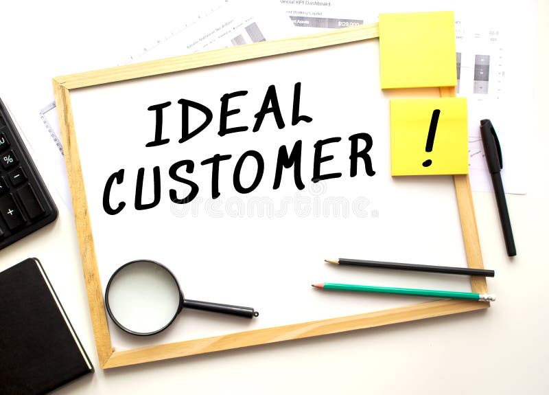 IDEAL CUSTOMER Text is Written on a White Office Board. Work Table with ...