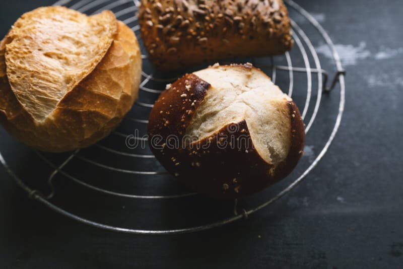 Different Kinds of Bread Rolls of a Bakery Grid on a Black Board Stock ...