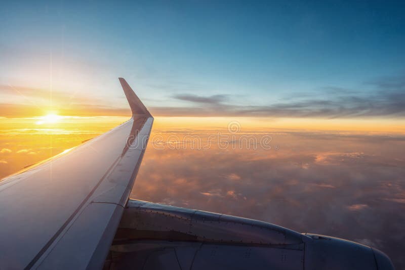 View of the Sunset,clouds and Airplane Wing from the Inside Stock Image ...