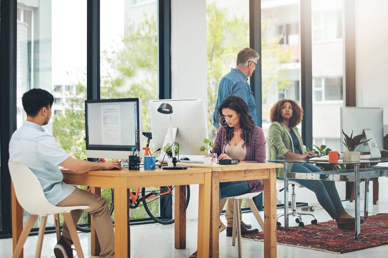 Ideas are Easy Implementation Takes Work. Group of Creative Colleagues ...