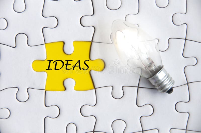 Ideas Text on Missing Jigsaw Puzzle with Light Bulb Background ...