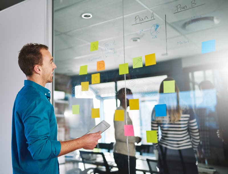 Ideation in the Name of Creation. a Young Man Using a Digital Tablet ...