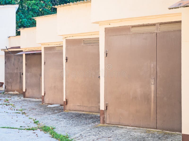 Identical Car Garages with Iron Brown Gates are Built in a Row Stock ...