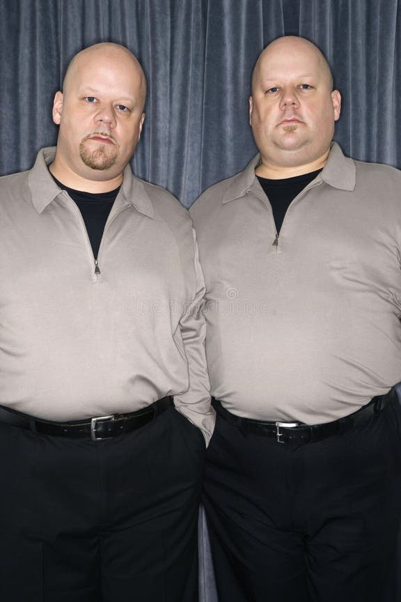 Identical twin men. stock image. Image of people, indoors - 2431225
