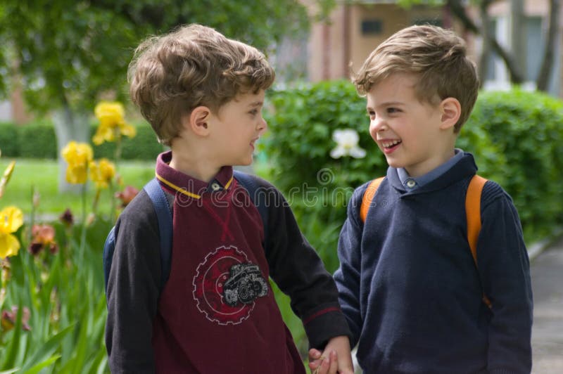 Identical twins held hands stock image. Image of twins - 54906707