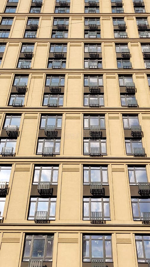 Identical Windows of the Facade of a High-rise Building in Even ...