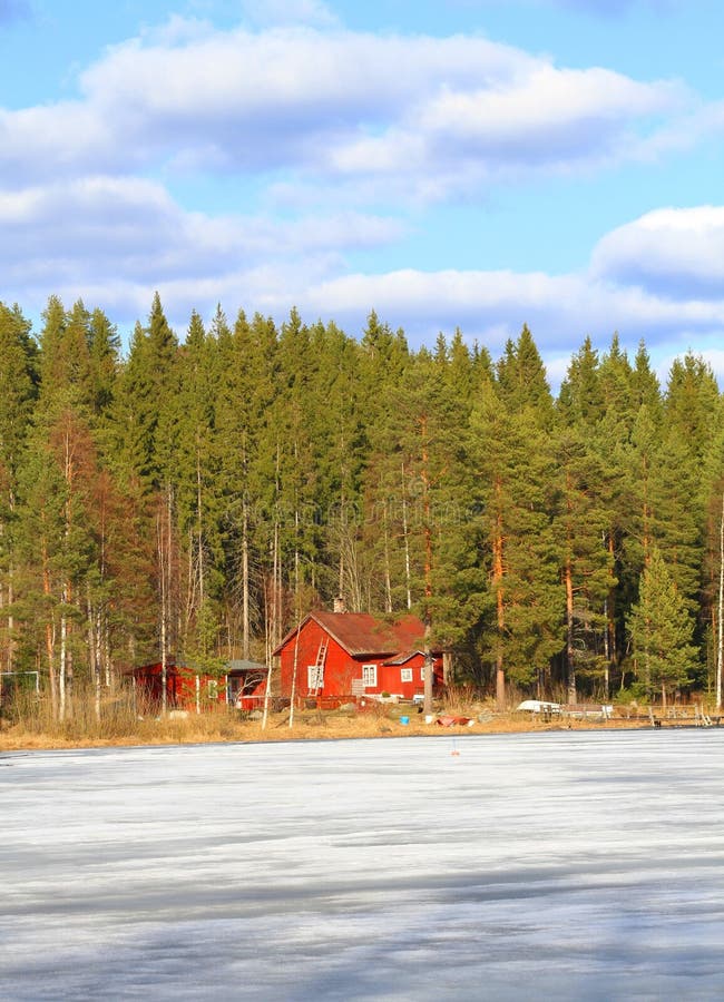 A Traditional Finnish Wooden Cottage with a Sauna and a Barn on the ...