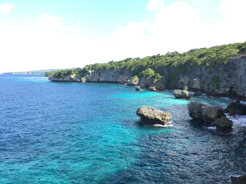 Idyllic Appalarang Cliff Overlooking a Tranquil Ocean Inlet with Serene ...