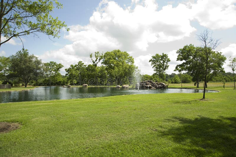 Idyllic Country Setting with Pond Stock Image - Image of cloudy, blue ...