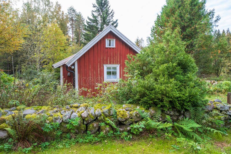 Idyllic Little Red Cottage by a Stone Wall Stock Photo - Image of stone ...