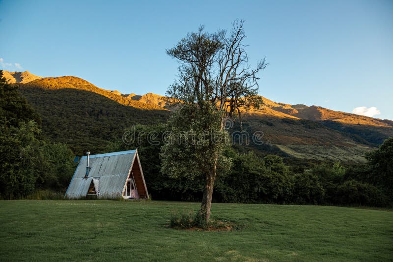 Idyllic Mountain Retreat with a Triangular-shaped Cabin Surrounded by ...