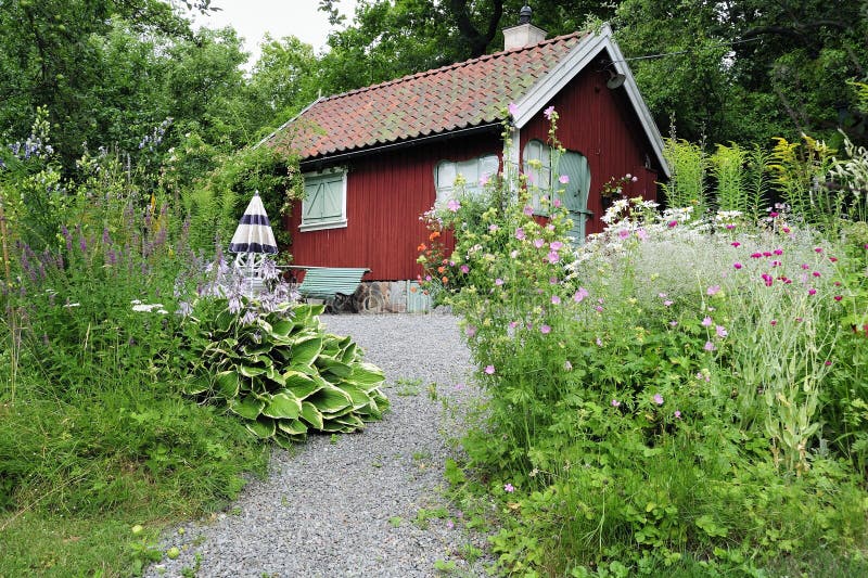 Idyllic Red Cottage in Botanical Garden Stock Photo - Image of people ...