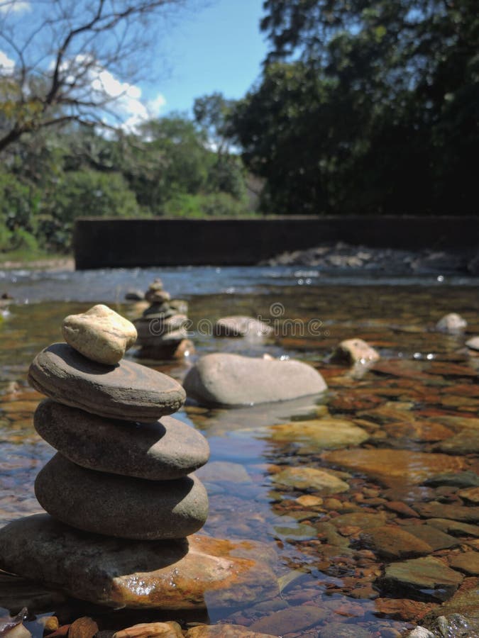 Idyllic Scene Featuring a Stack of Rocks in a Shallow Stream Stock ...