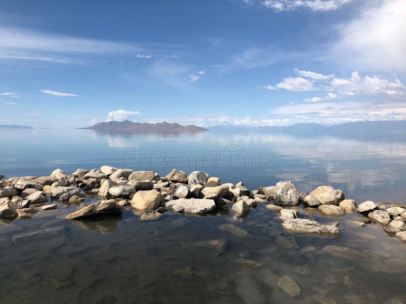 Idyllic Scene of a Tranquil Lake with Rock Barrier Stock Image - Image ...