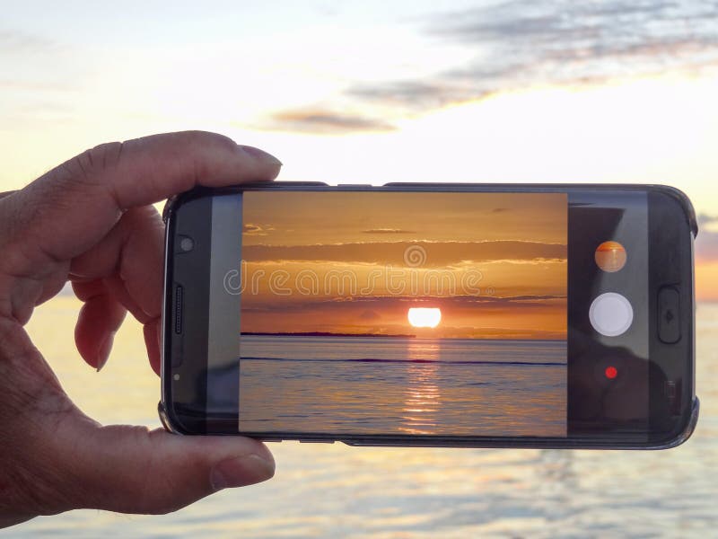 Sunset at mobile phone stock photo. Image of sunny, sundown - 116603222