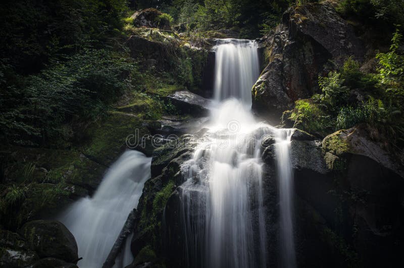 Idyllic Waterfall Falls into a Dark Gorge. Stock Photo - Image of ...