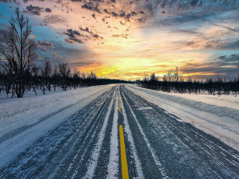 Idyllic Winter Scene Featuring a Long and Desolate Road Surrounded by a ...