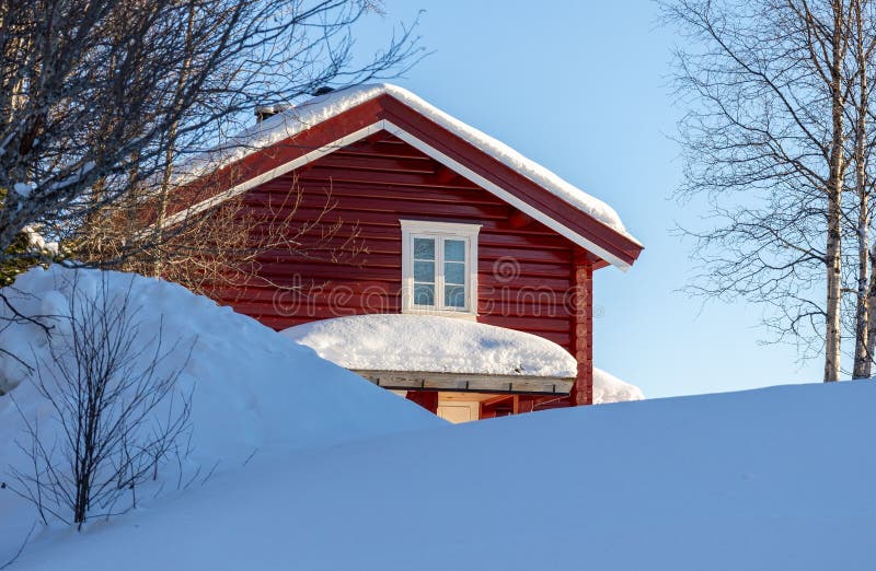 Idyllic Winter Scene with a Red House Situated Behind Rows of Trees ...