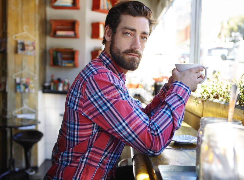 If it Aint Caffeinated, it Aint Coffee. a Young Man Drinking Coffee in ...