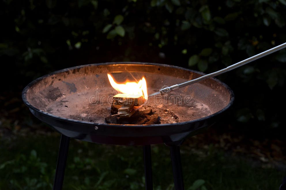 Ignition of the Fire with Gas Lighter Stock Photo - Image of burn ...