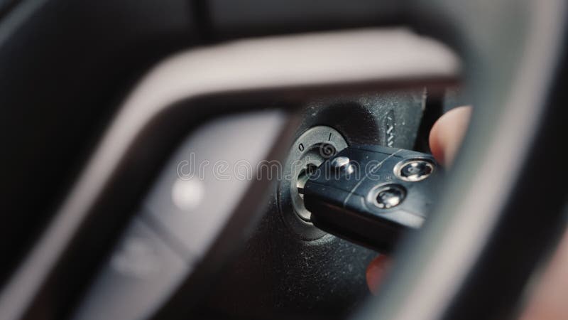 The Ignition Key is Inserted into the Well and Start the Car Engine ...