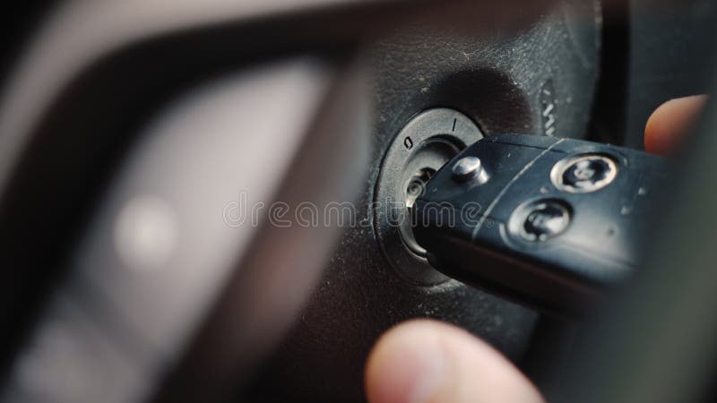 The Ignition Key is Inserted into the Well and Start the Car Engine ...