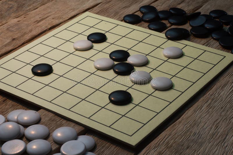 Igo Chinese Board Game with Black and White Stone Stock Photo - Image ...
