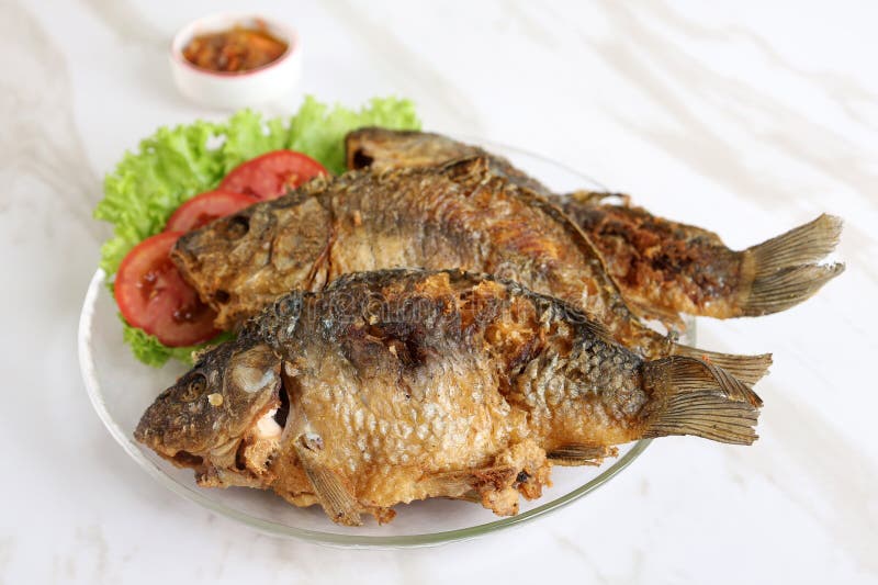 Ikan Mas Goreng or Crispy Fried Fish Stock Image - Image of cooking ...