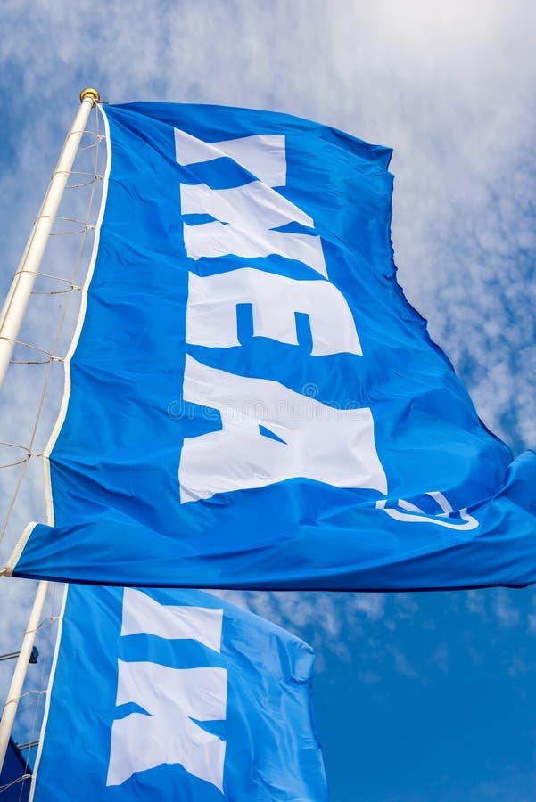 IKEA Flags Waving on Wind Against a Blue Sky Near the IKEA Samar ... IKEA Flags Waving on Wind Against a Blue Sky Near the IKEA Samar ...