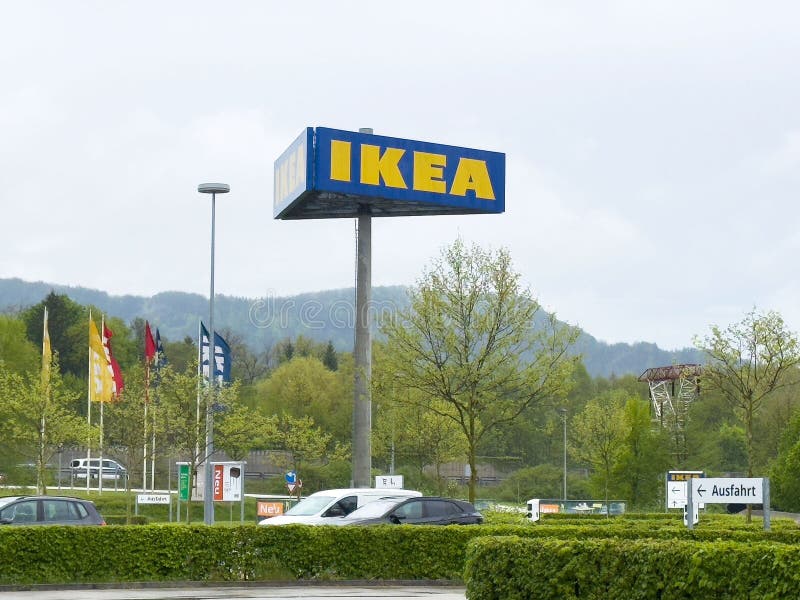 Ikea Storefront Sign with Parking Lot and Flags on a Cloudy Day ...