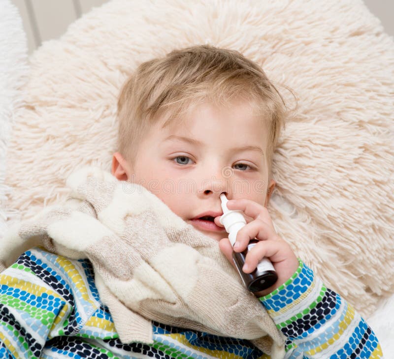 Ill Boy with Flu at Home Using Nose Spray Stock Image - Image of bottle ...