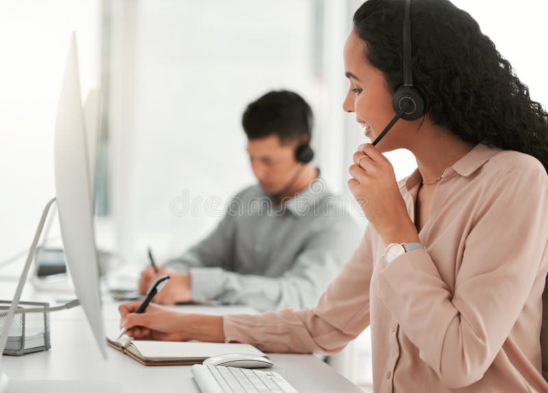 Ill Make a Note of that. Two Young Call Center Agents Working in an ...