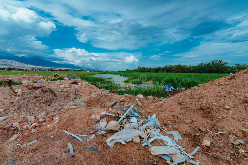 Illegal Dumpster on Field by the Pond Stock Image - Image of ...
