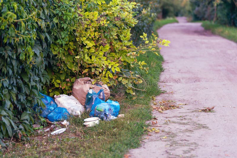 Illegal Garbage Dump on a Dirt Road, Plastic and Other Waste. Dangerous ...