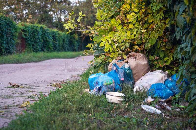 Illegal Garbage Dump on a Dirt Road, Plastic and Other Waste. Dangerous ...