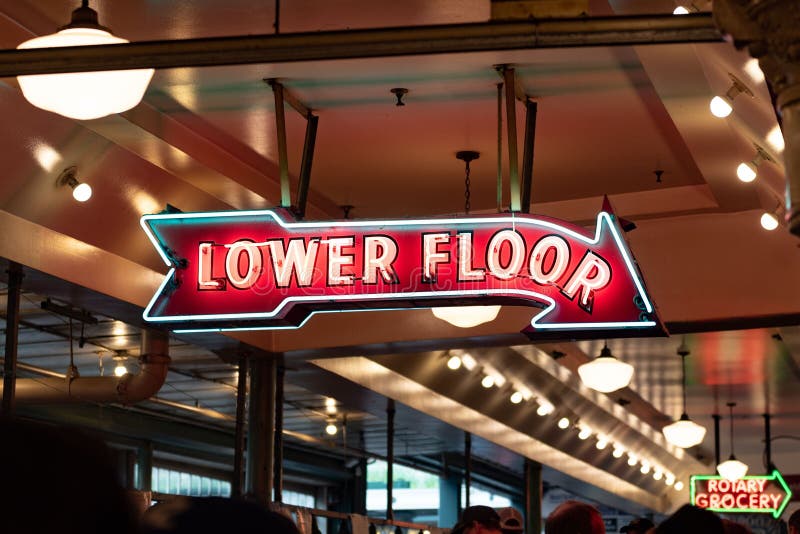 Illuminated Arrow Sign with Lower Floor Text Hanging on the Ceiling ...