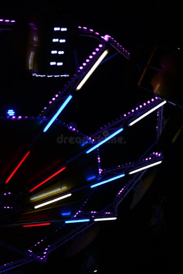 Illuminated Attraction in Amusement Park at Night Stock Photo - Image ...