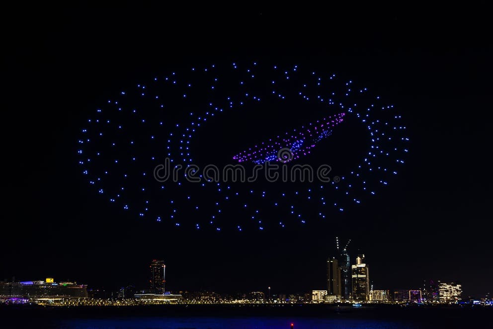 Illuminated Blue Drones Glowing in the Black Night Sky and Forming ...