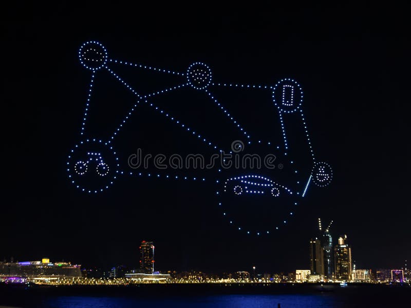 Illuminated Blue Drones Glowing in the Black Night Sky and Forming ...