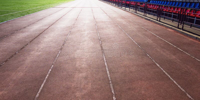 Illuminated by the Bright Sun Running Track in the Stadium Stock Photo ...