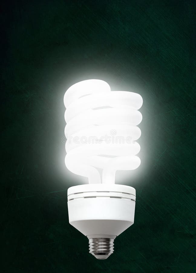 Illuminated CFL Compact Fluorescent Light Bulb on Chalkboard Background ...