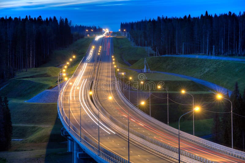 Illuminated Forest Highway Bridge At Evening With Light Trails. Stock ...
